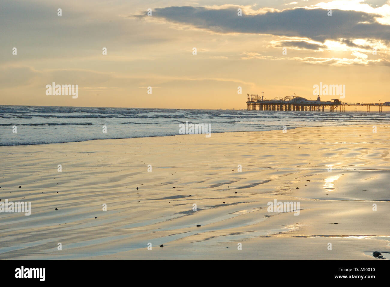 Wonderful sun set sun sinks into the water behind the ruined west pier ...