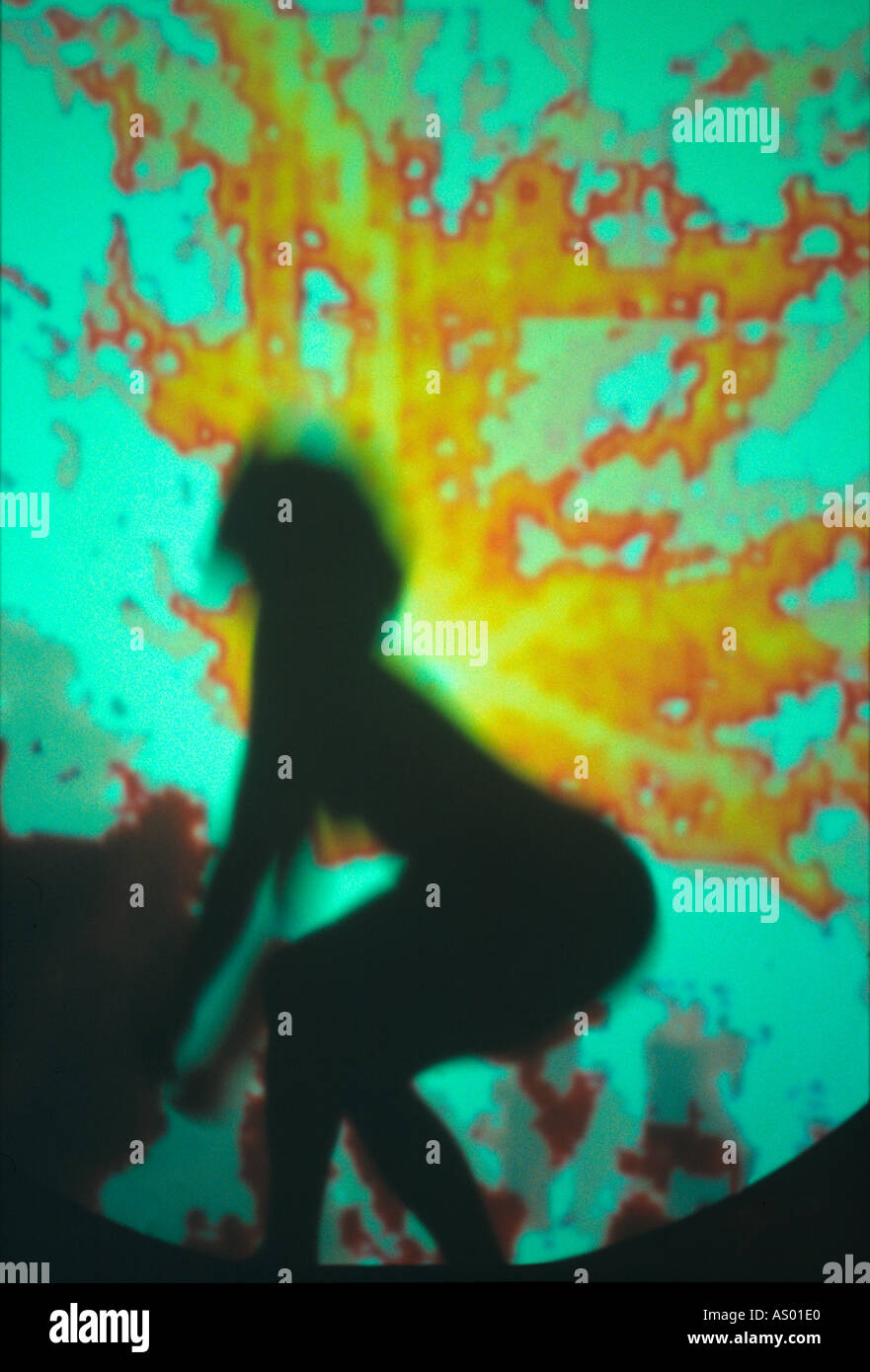 shadow of a dancer with coloured light around James Bond style Stock ...