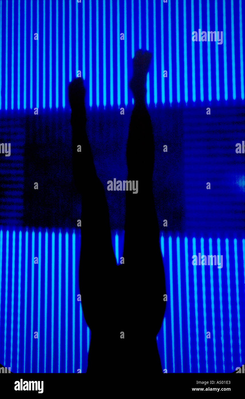 shadow of a dancer with coloured light around James Bond style Stock ...