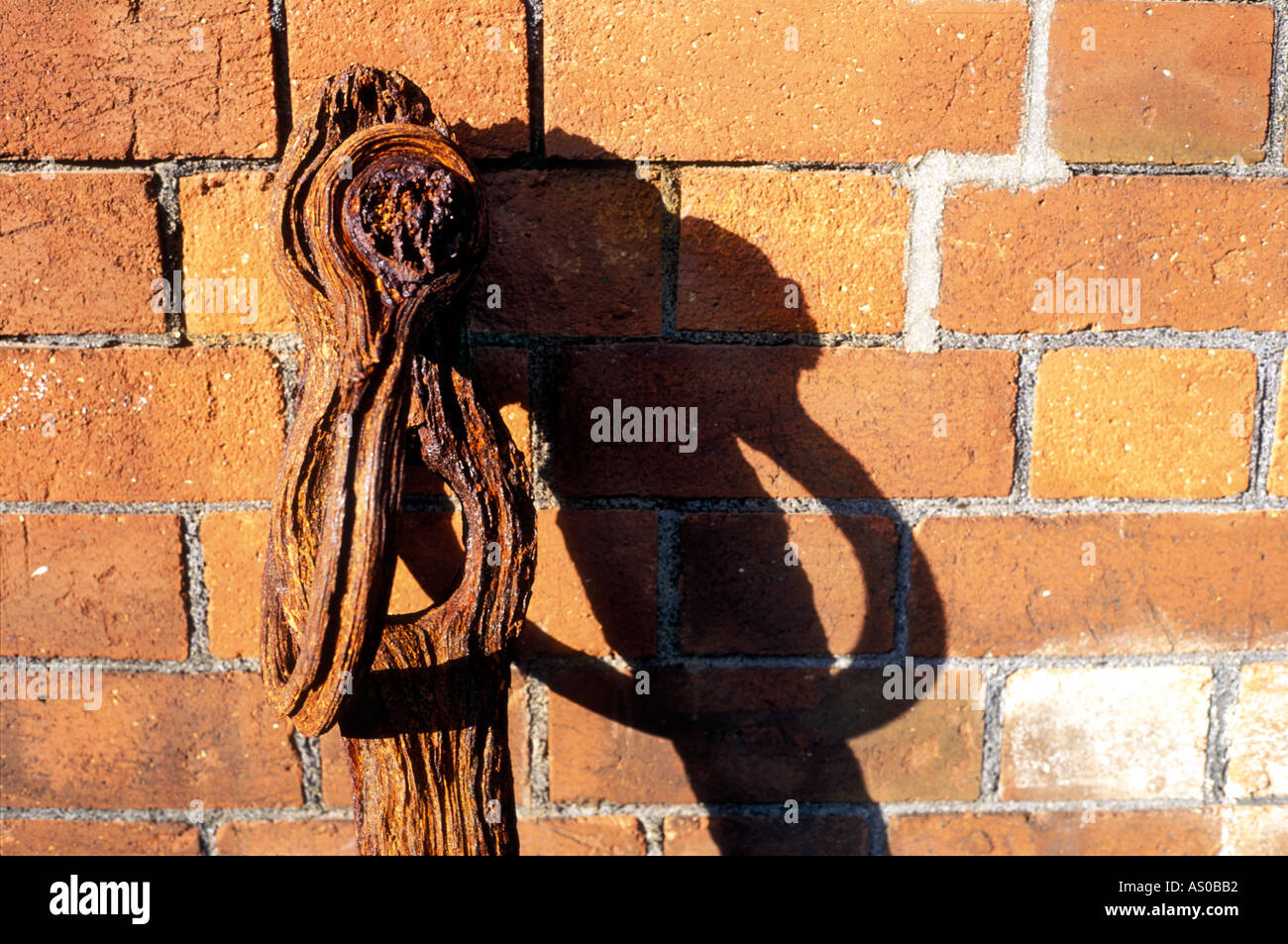the end of a rusty anchor leaning against a wall Stock Photo - Alamy