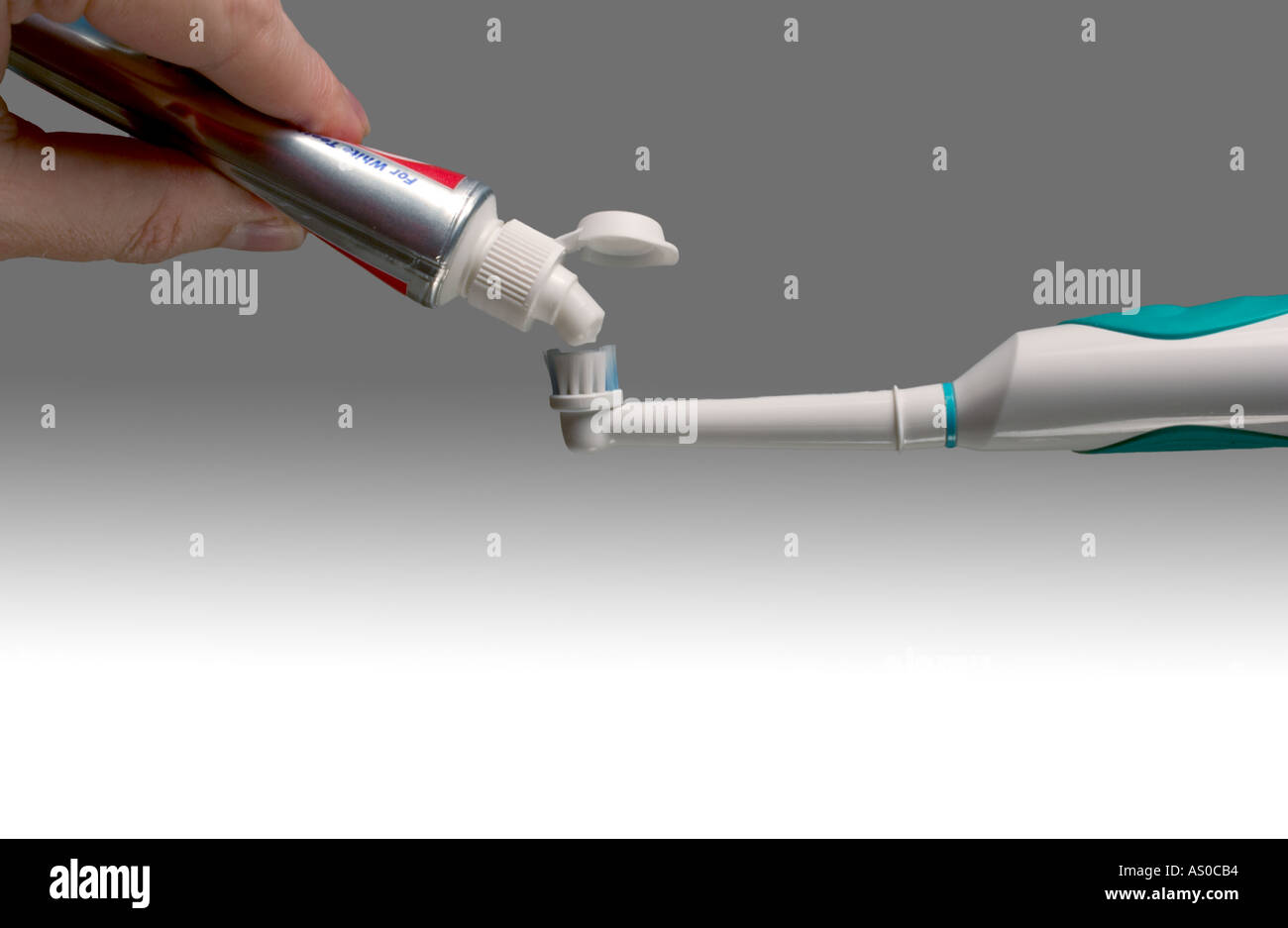 Squeezing toothpaste onto toothbrush hi-res stock photography and ...