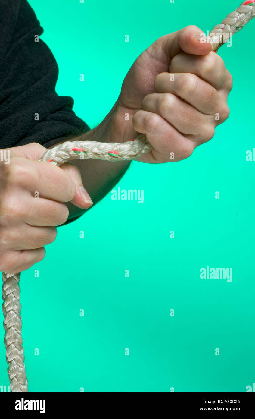 hands pulling on a rope Stock Photo - Alamy