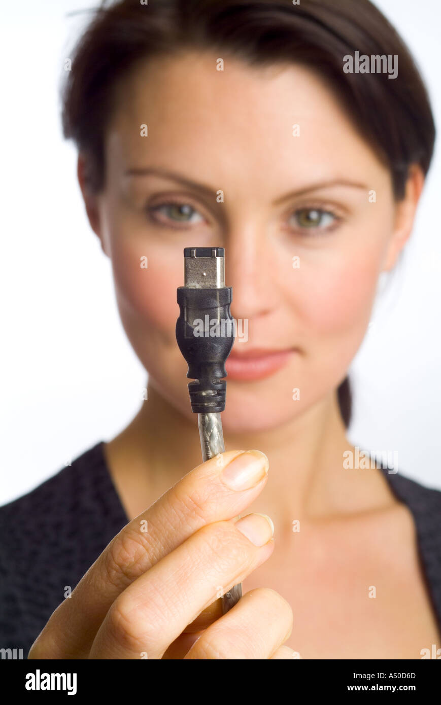 Woman plugging computer hi-res stock photography and images - Alamy