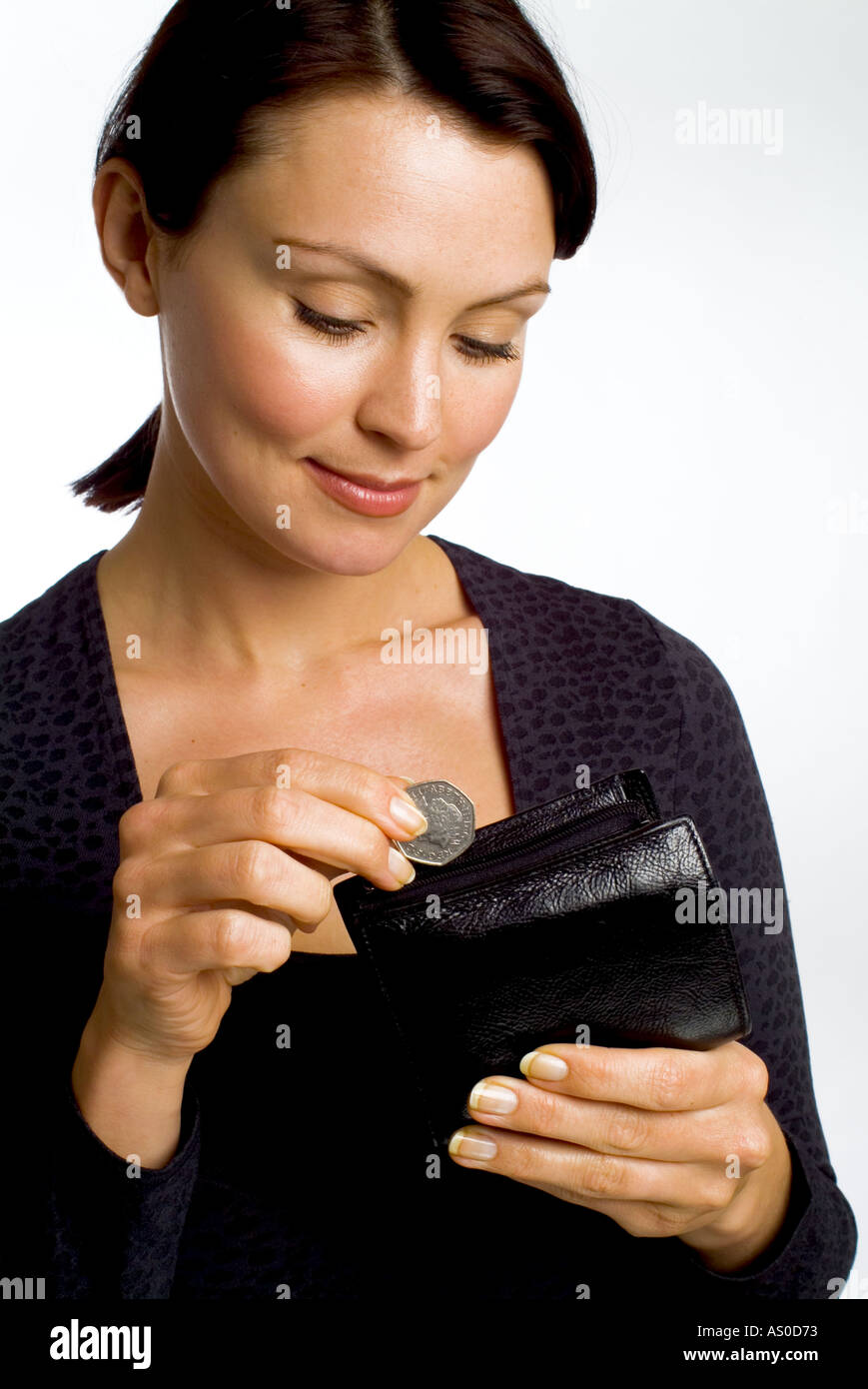 woman looking in her purse Stock Photo - Alamy