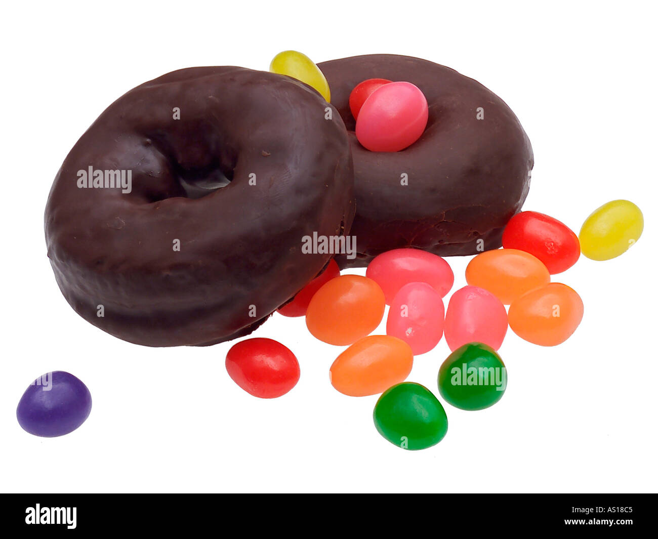Junk food doughnuts and jelly beans silhouetted on white background ...