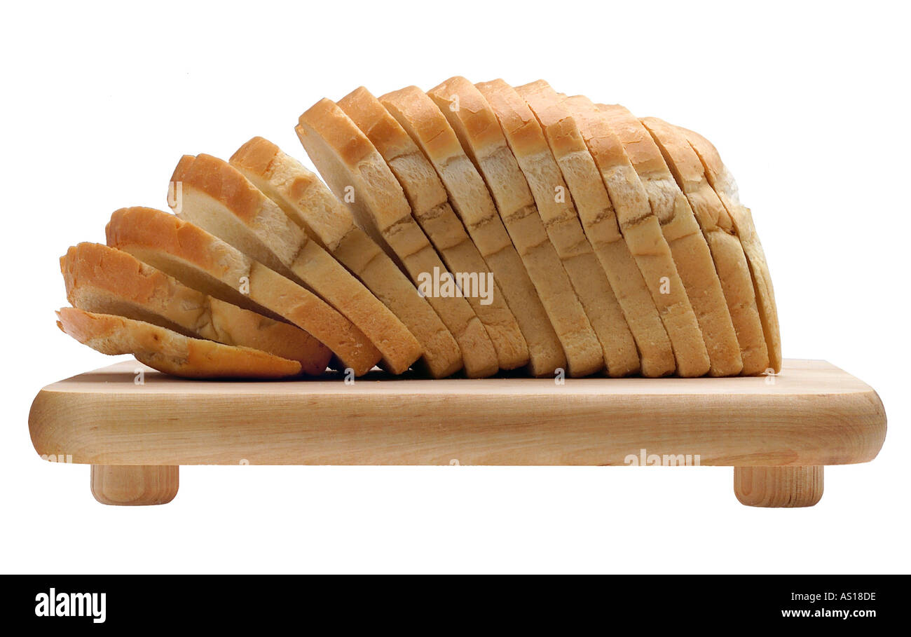 Loaf of sliced bread on a cutting board silhouetted on white background ...