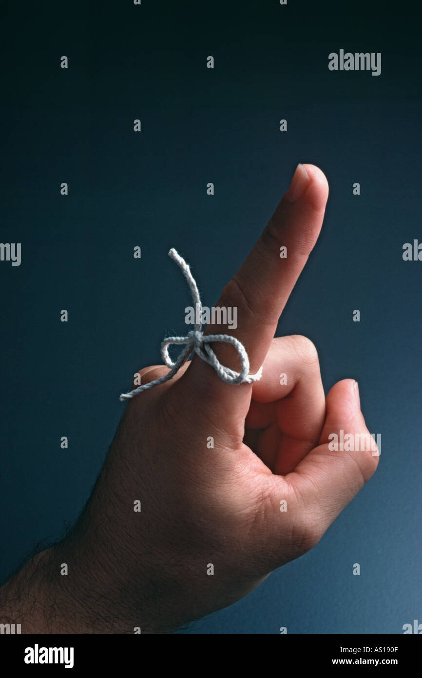 Index finger with string Stock Photo - Alamy
