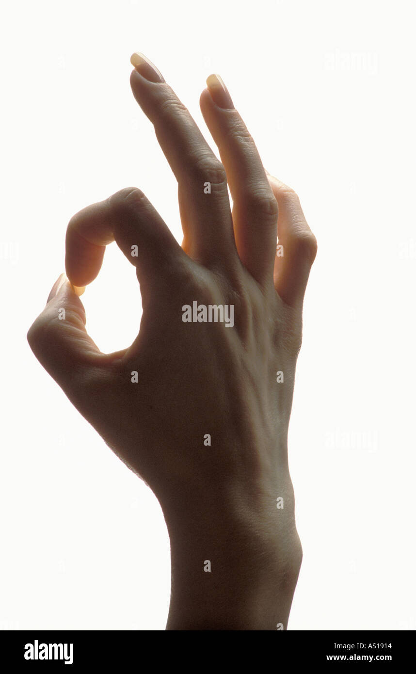 Woman's hand giving the A OK gesture Isolated on white background Stock ...
