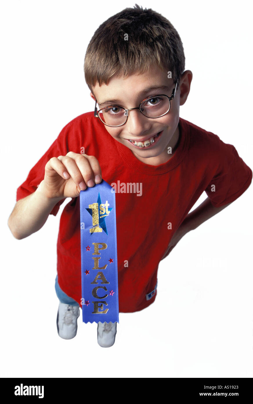 Boy holding first place ribbon silhouetted on white background Stock ...