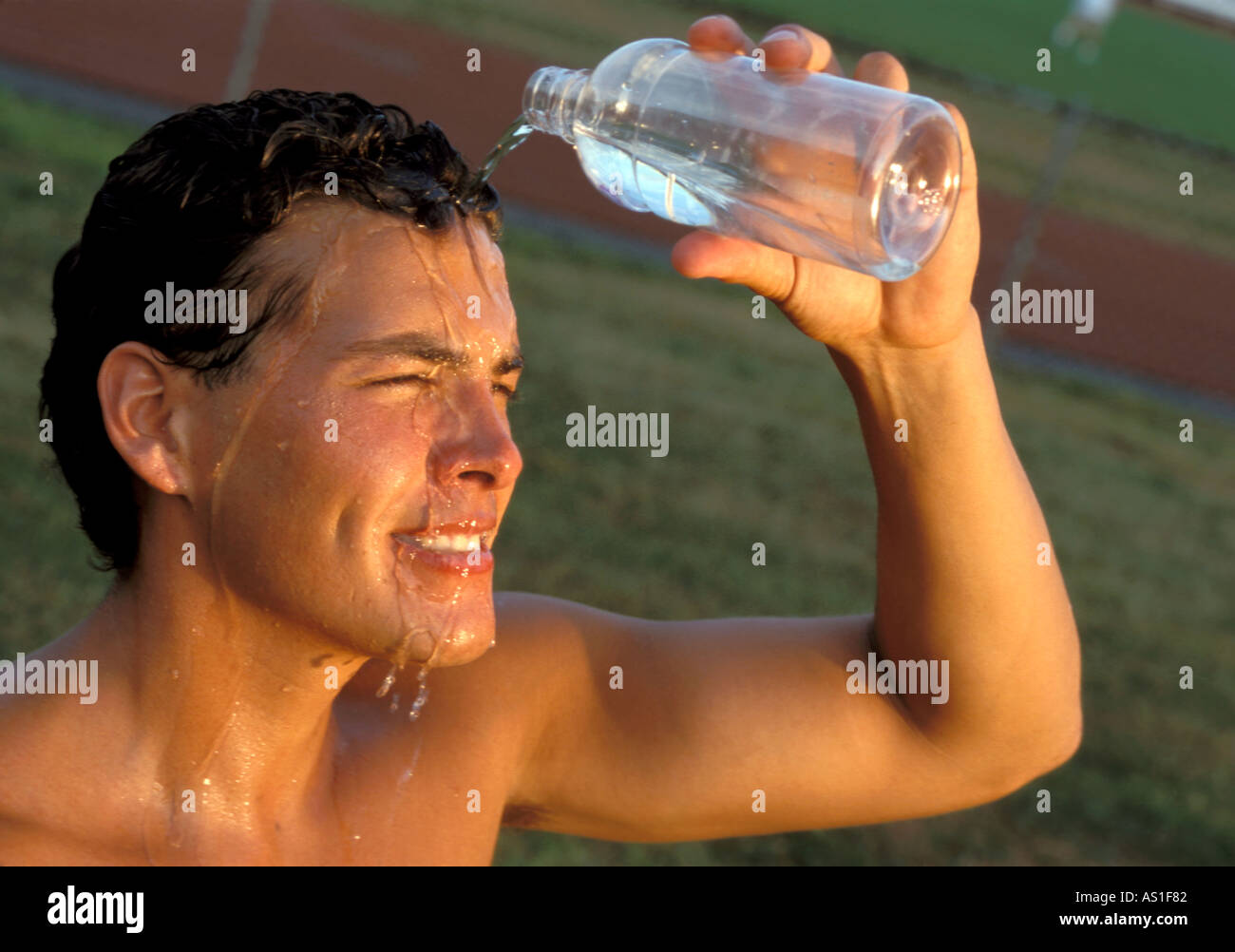 Man pouring water on head Stock Photo - Alamy