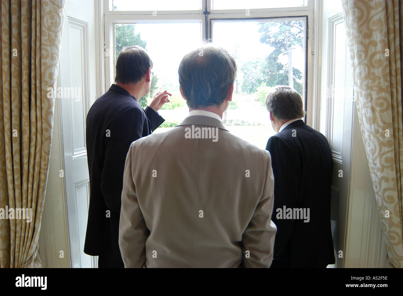 Three men look hi-res stock photography and images - Alamy
