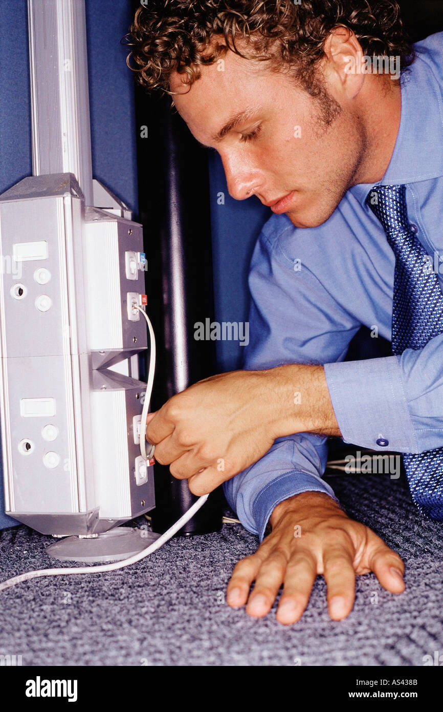 Man putting computer cable into a socket Stock Photo - Alamy Man putting computer cable into a socket Stock Photo - Alamy