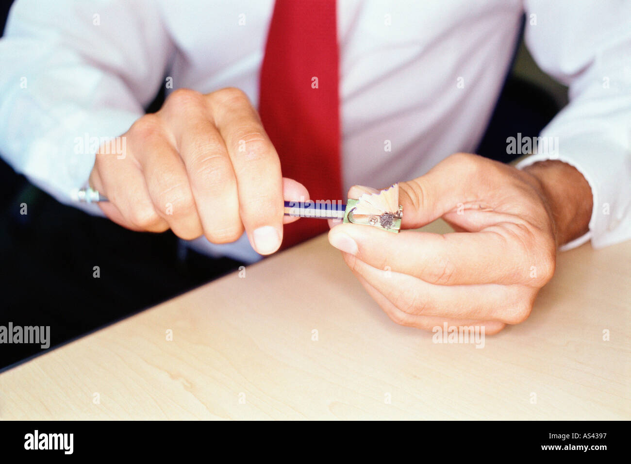 Man sharpens pencil Stock Photo - Alamy