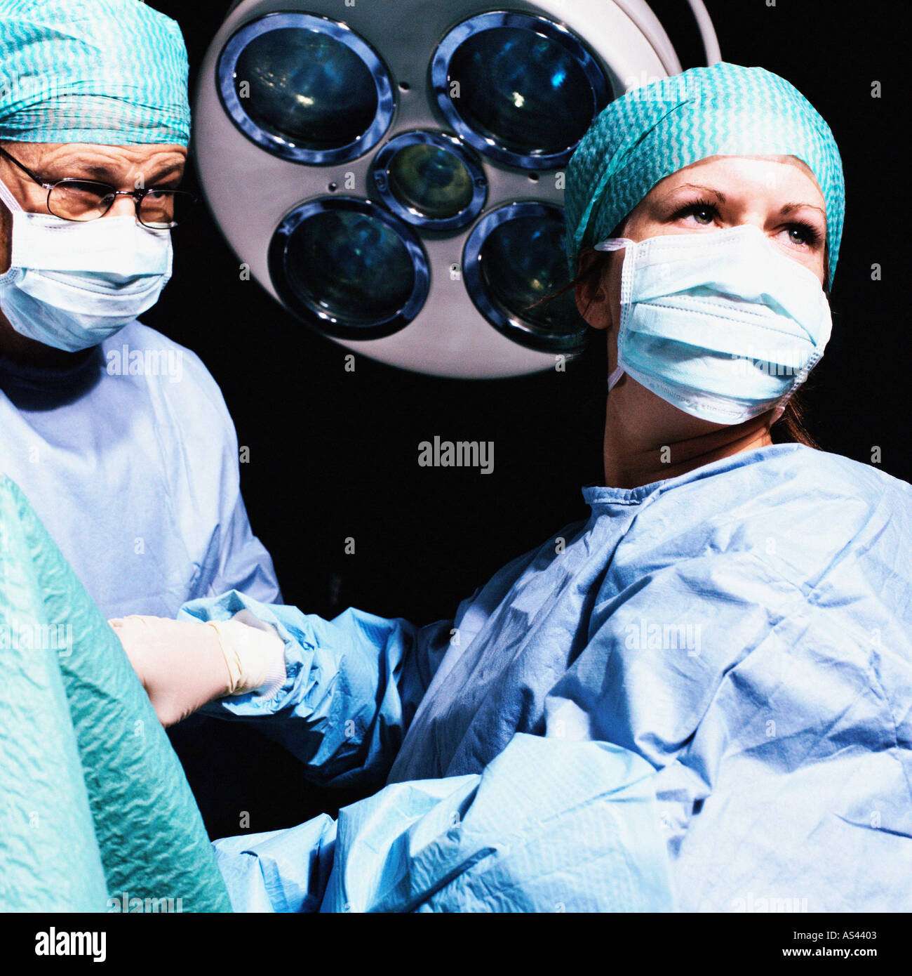 Surgical team watch monitor Stock Photo - Alamy