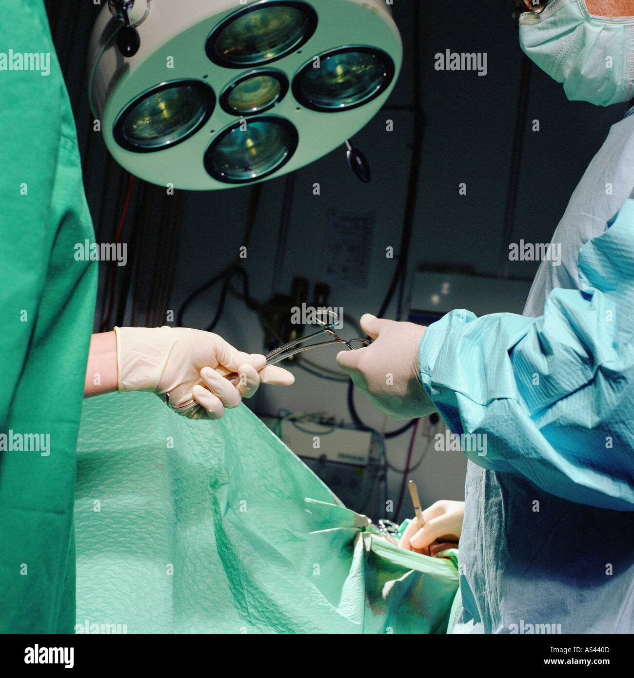 Nurse handing sterile tools Stock Photo - Alamy