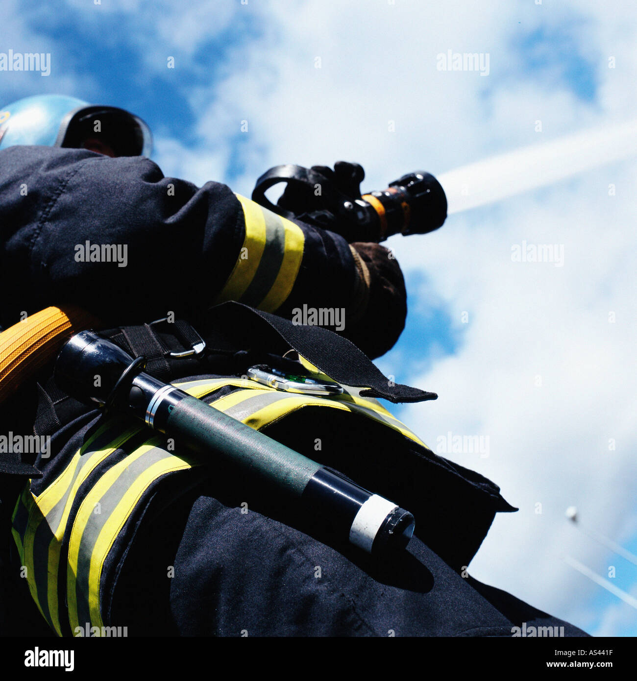 Fireman with hose hi-res stock photography and images - Alamy