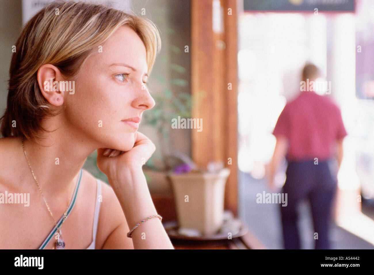 Wistful young woman Stock Photo - Alamy