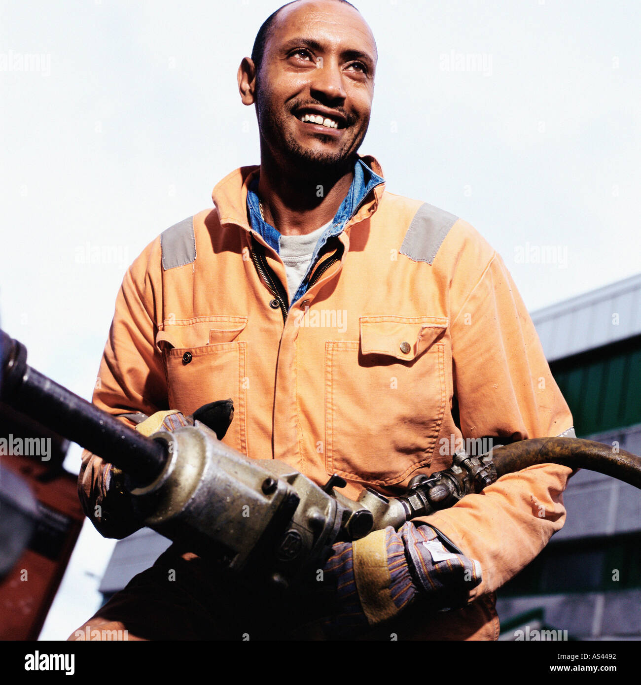 Construction worker using pneumatic drill Stock Photo - Alamy