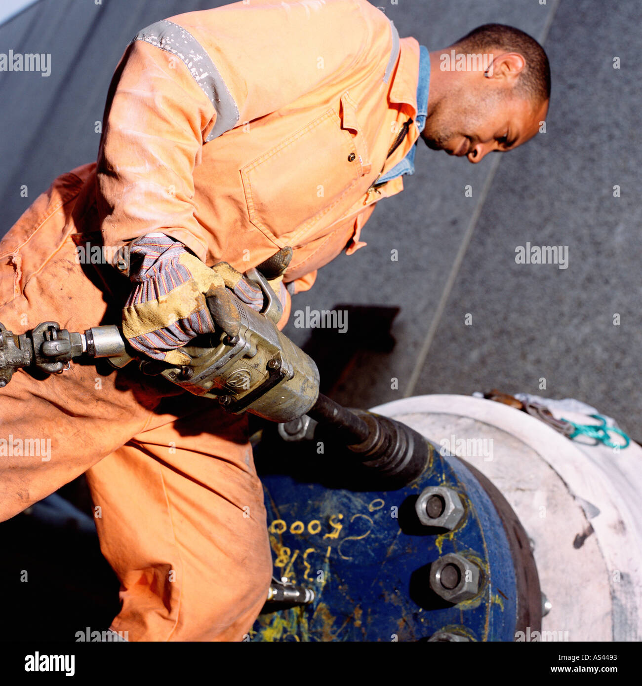 Construction worker using pneumatic drill Stock Photo - Alamy