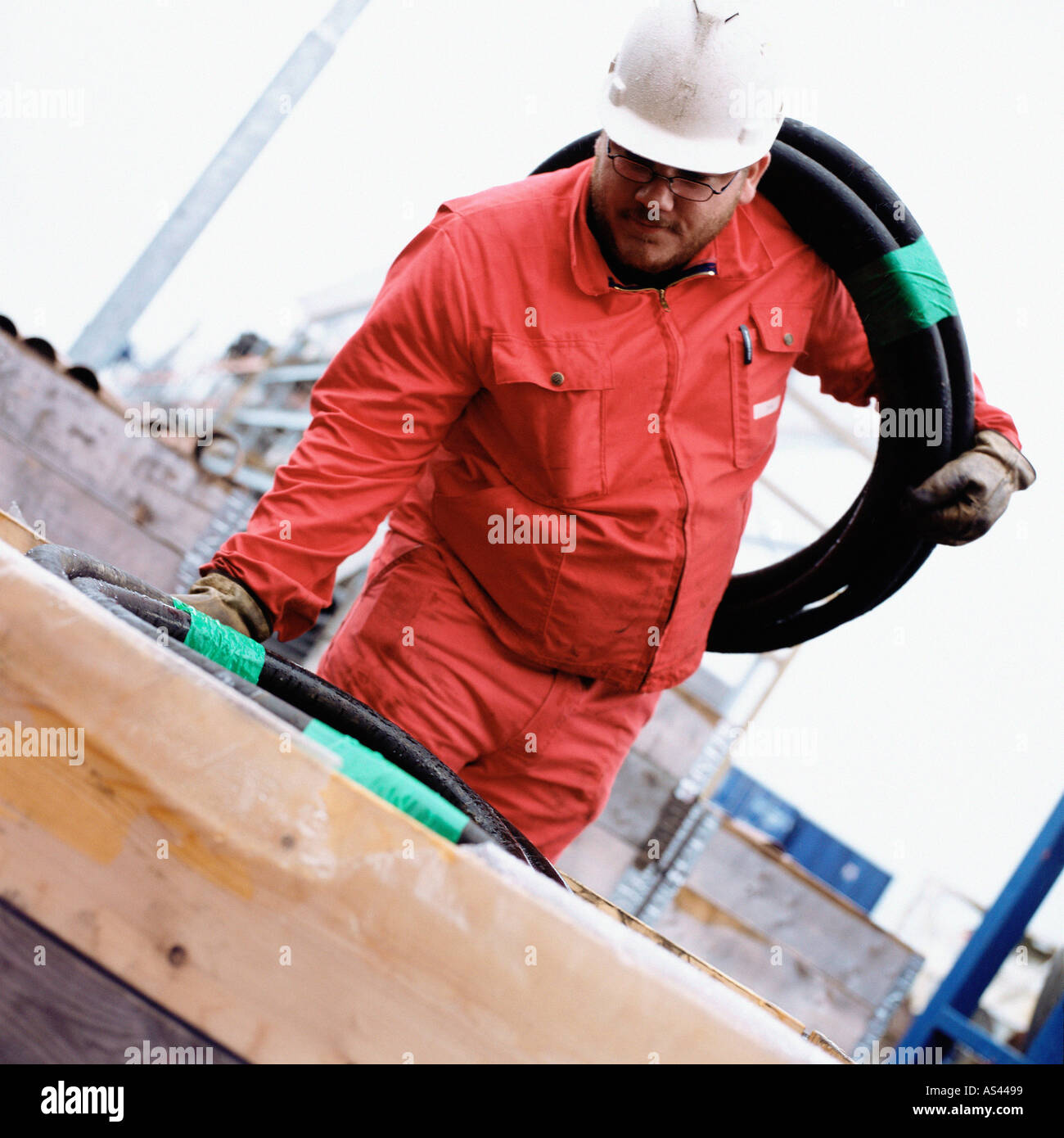 Engineer holding pipe Stock Photo - Alamy