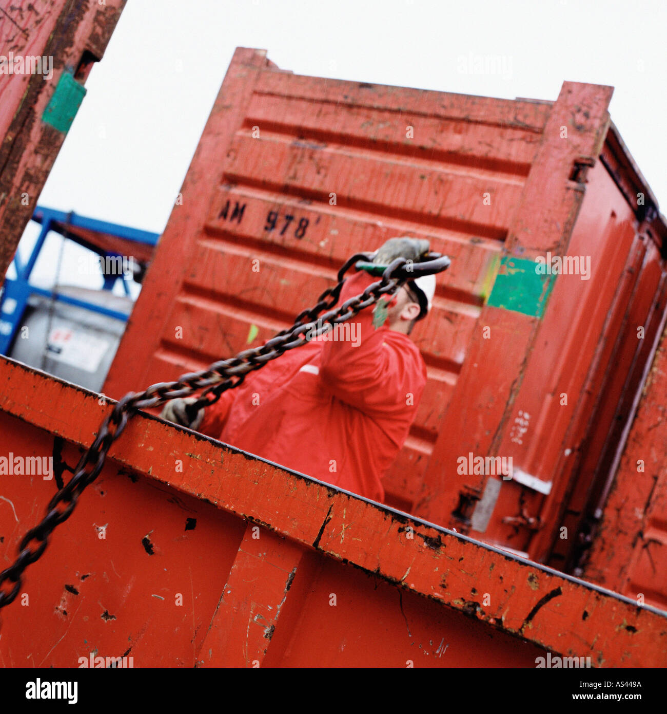 Construction worker holding chain Stock Photo - Alamy
