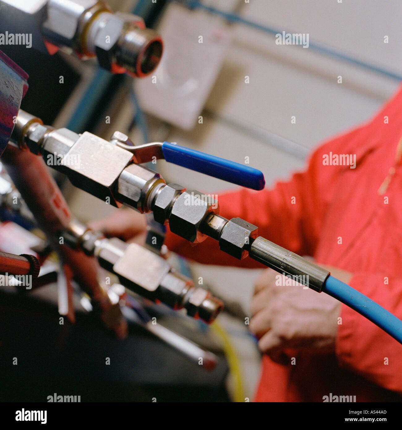 Engineer working on machine Stock Photo - Alamy