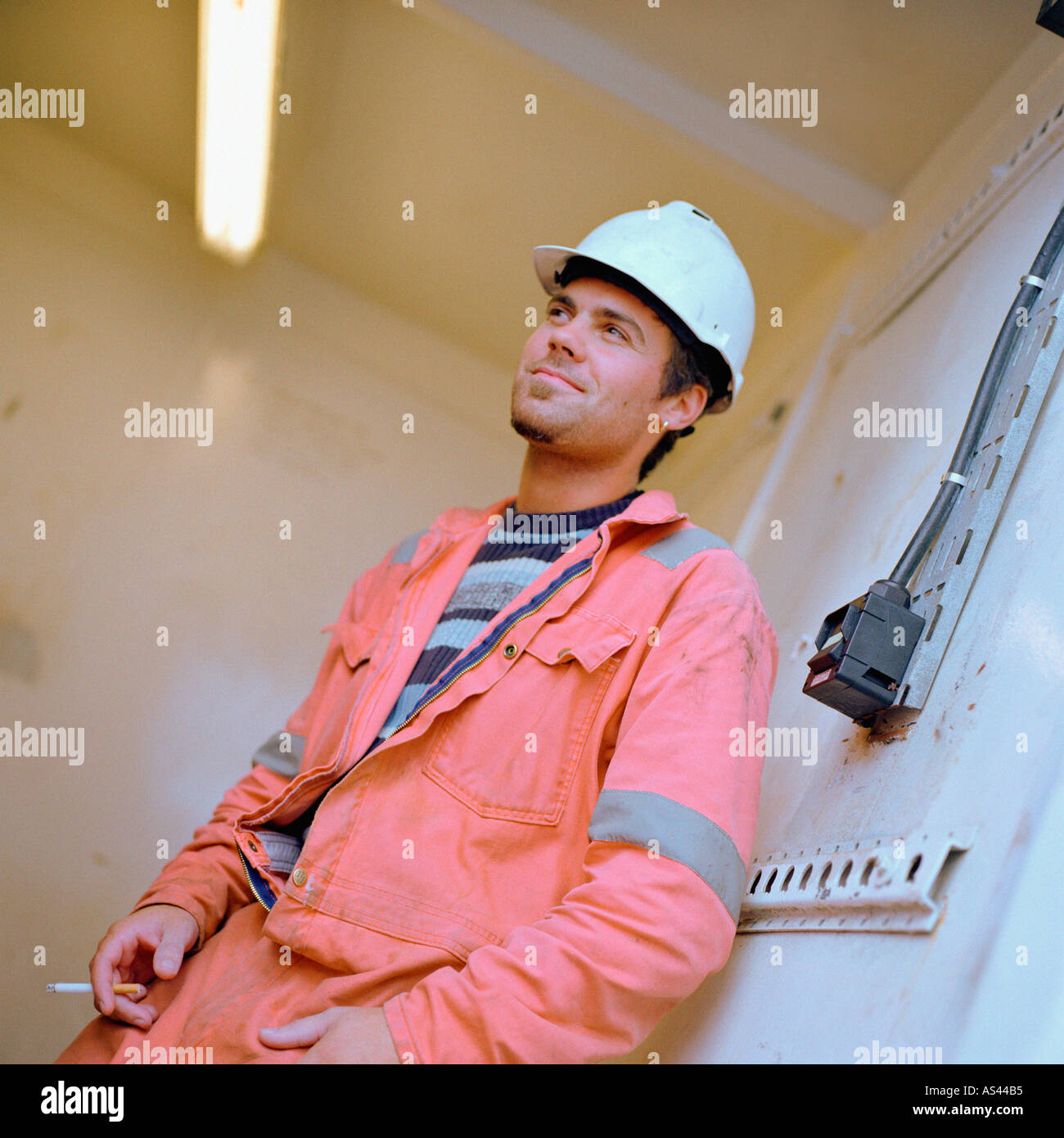 Construction worker smoking Stock Photo - Alamy