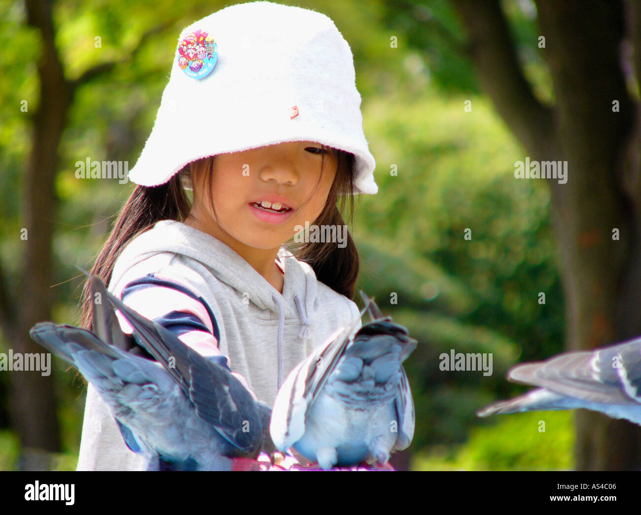 Girl with Pigeons Osaka Japan Stock Photo - Alamy