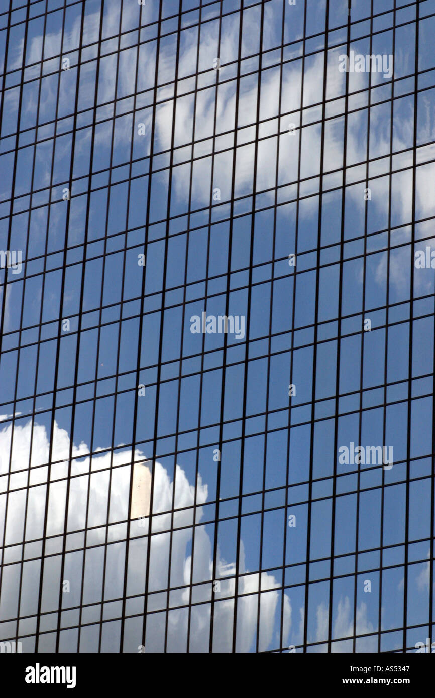 Clouds and sky reflected in the windows of a high rise building Stock ...