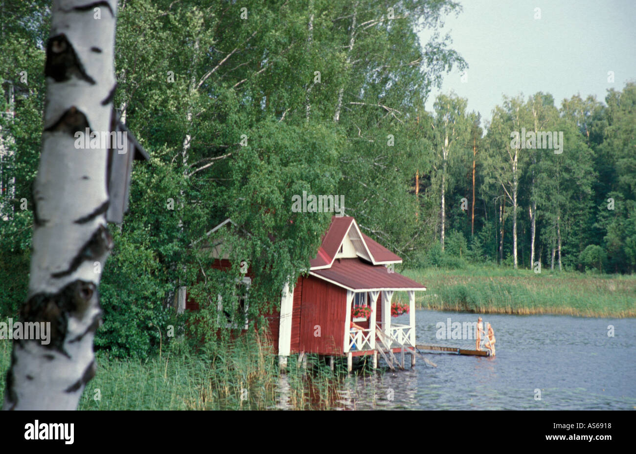 wooden cottage at lake Stock Photo - Alamy