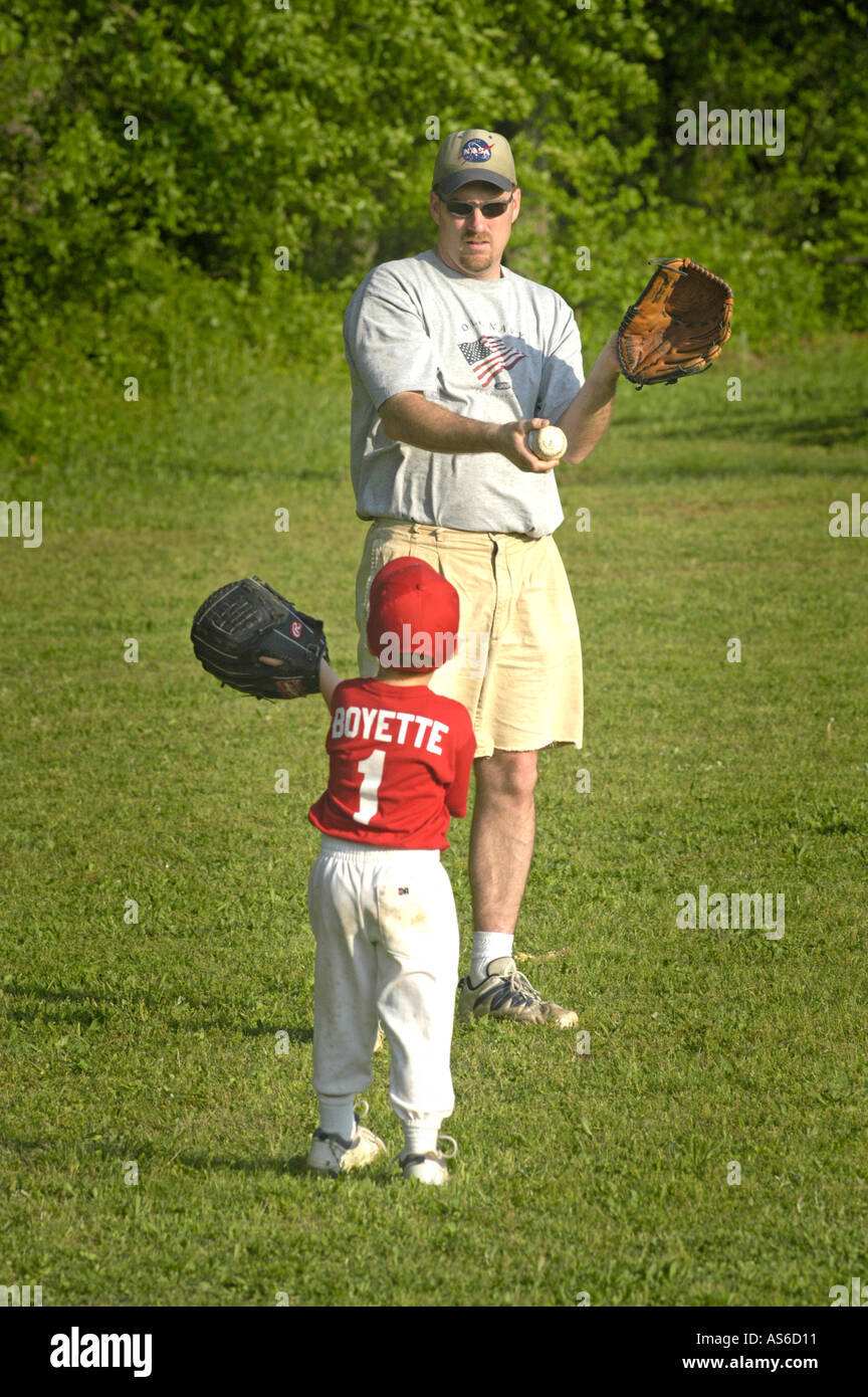 Son and Dad playing catch before real baseball game where it is 'T ...