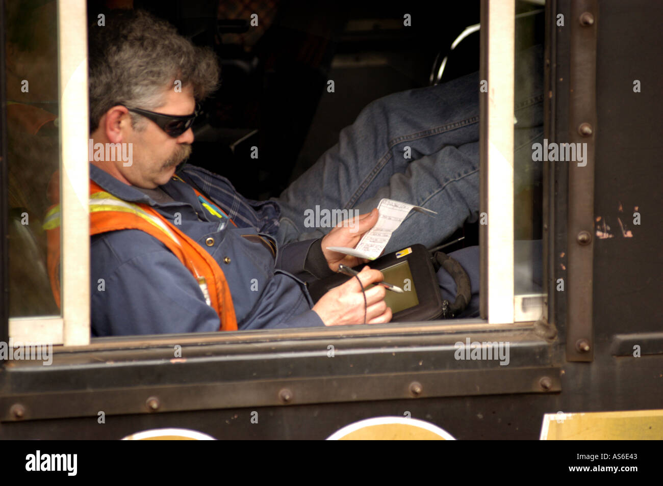 Engineer of train using handheld laptop computer for routing and ...