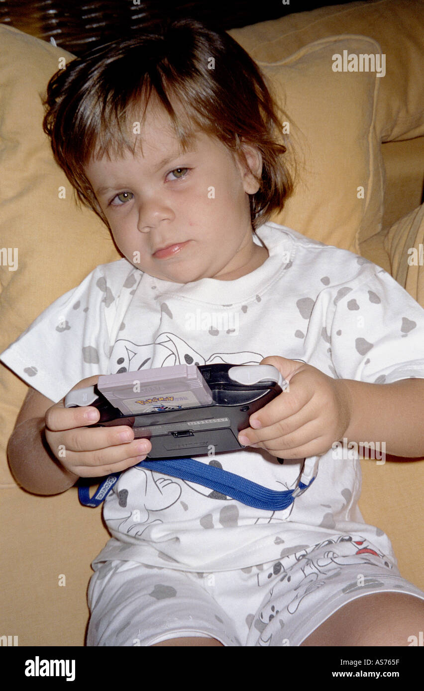 Girl playing game boy Stock Photo - Alamy