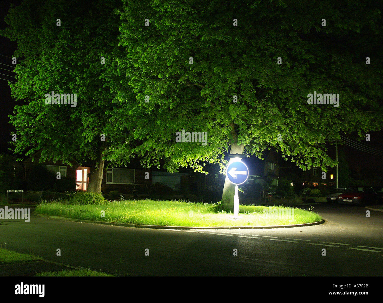 Residential roundabout at night Stock Photo - Alamy