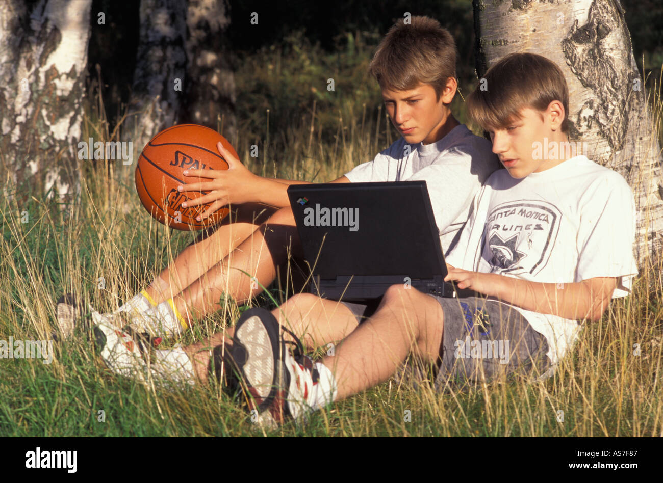 TWO BOYS WITH A LAPTOP COMPUTER Stock Photo - Alamy