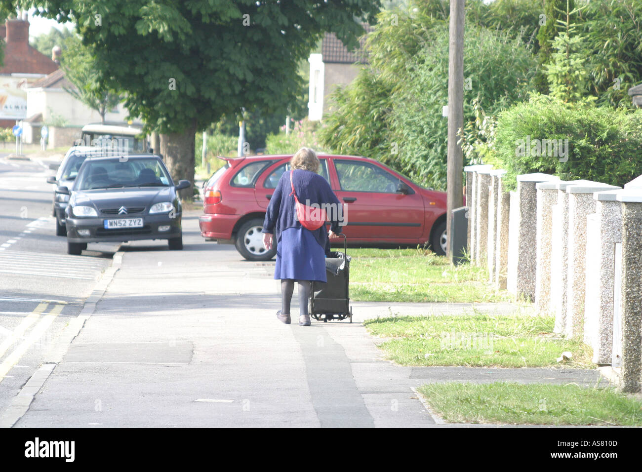 The footpath is blocked in front of an old woman by inconsiderate ...