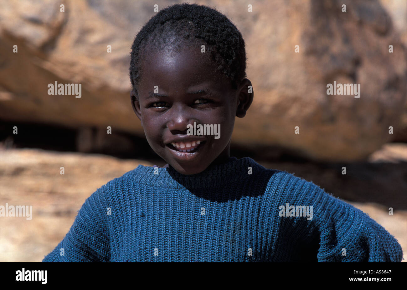 Friendly Damara boy living adjacent to the rock paintings nr Uis Stock ...