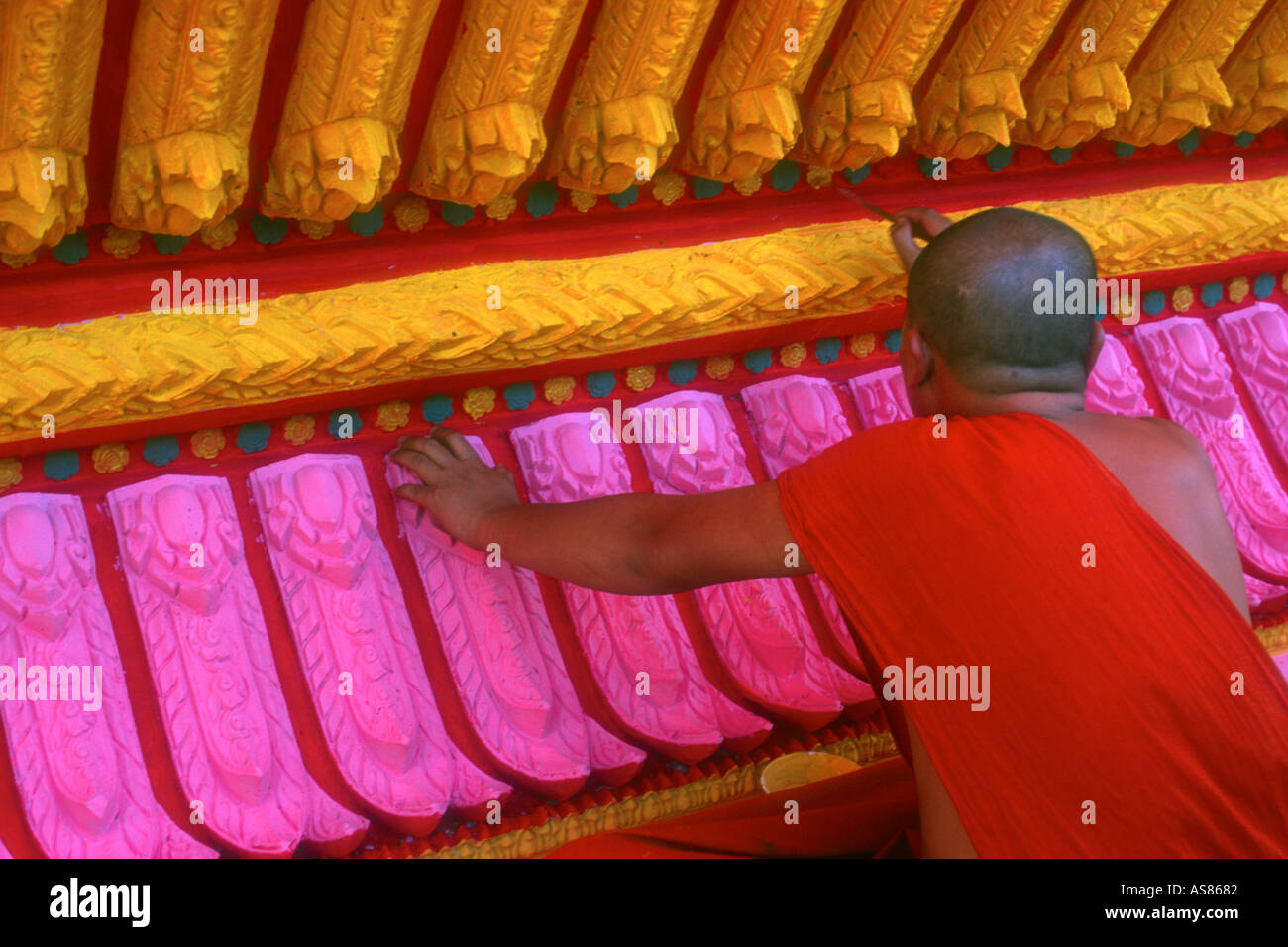 Buddhist monk painting a wat Laos Stock Photo - Alamy