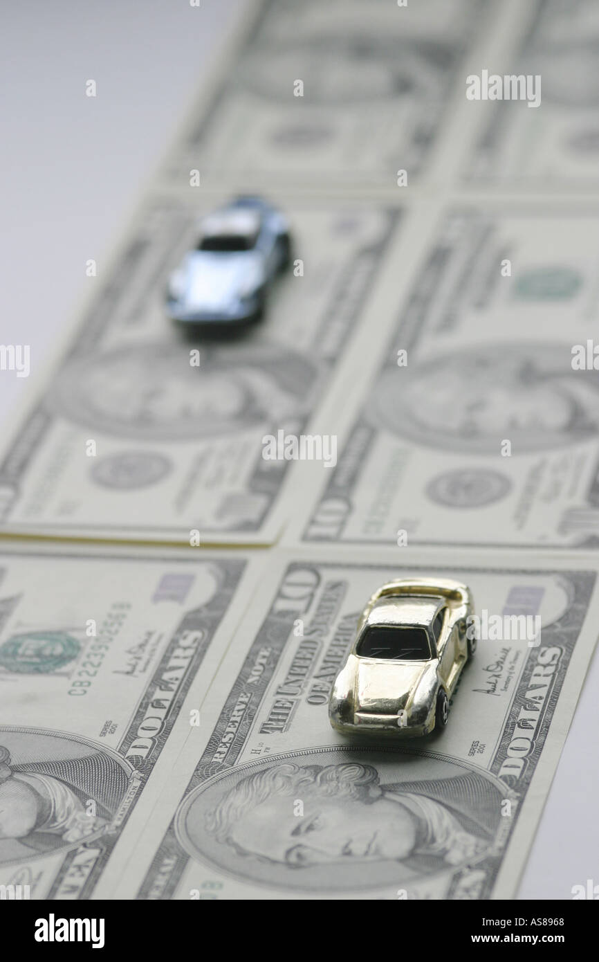 toy car riding on money road Stock Photo - Alamy