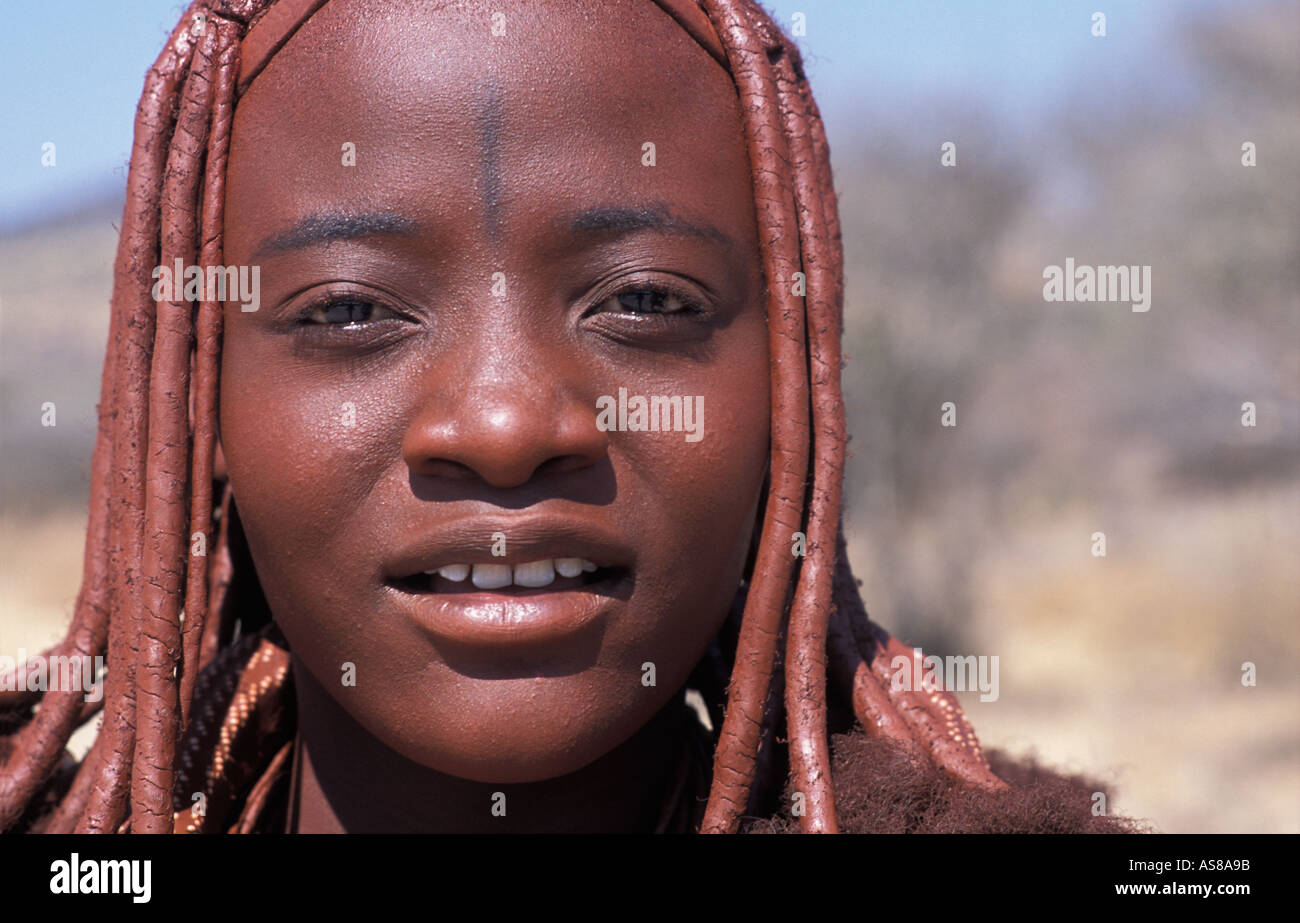 Himba woman and her distinctive hair decoration and adornments ...