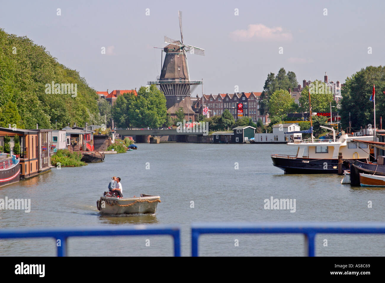Amsterdam Holland Nieuwevaart Canal and De Gooyer windmill Stock Photo ...
