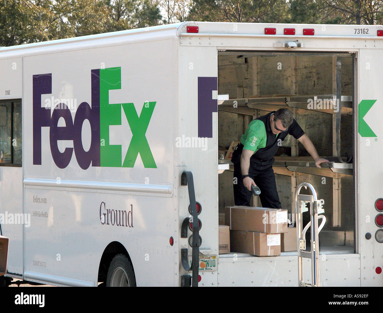 Fed Ex Employee Delivers Packages Stock Photo - Alamy