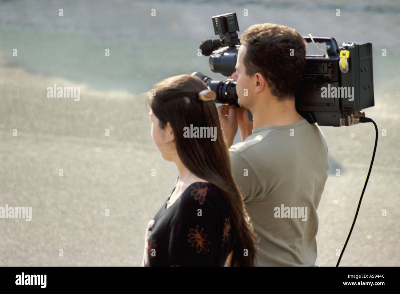 Cameraman man and woman at street Stock Photo - Alamy