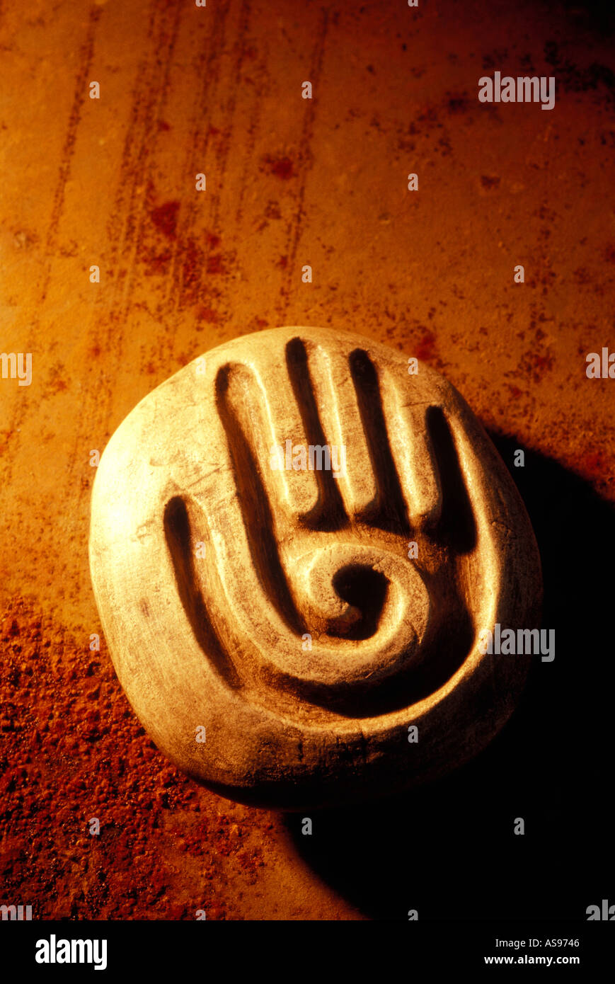 Hand print in stone Stock Photo - Alamy