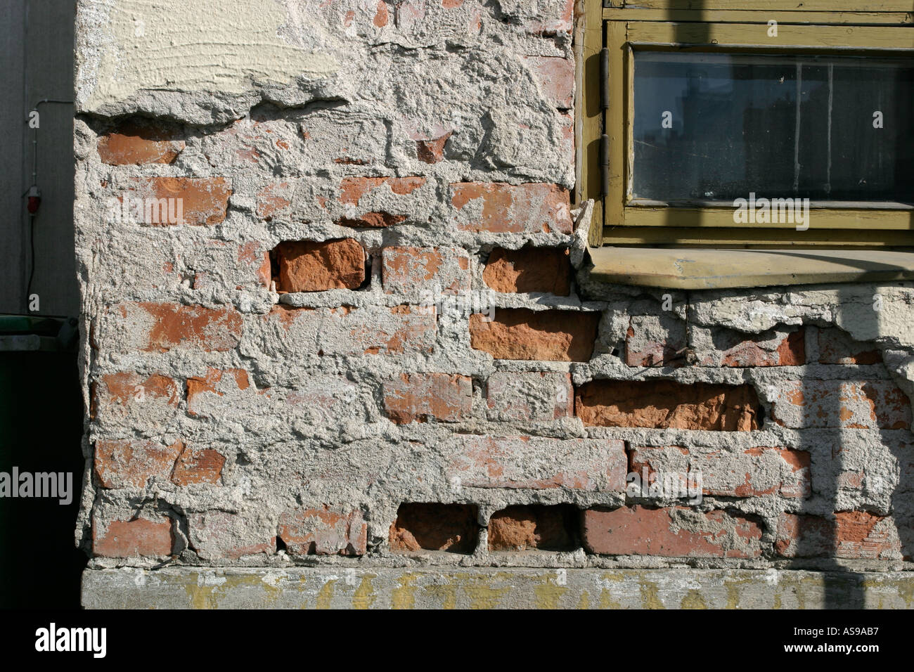 damaged plaster on building corner Stock Photo - Alamy
