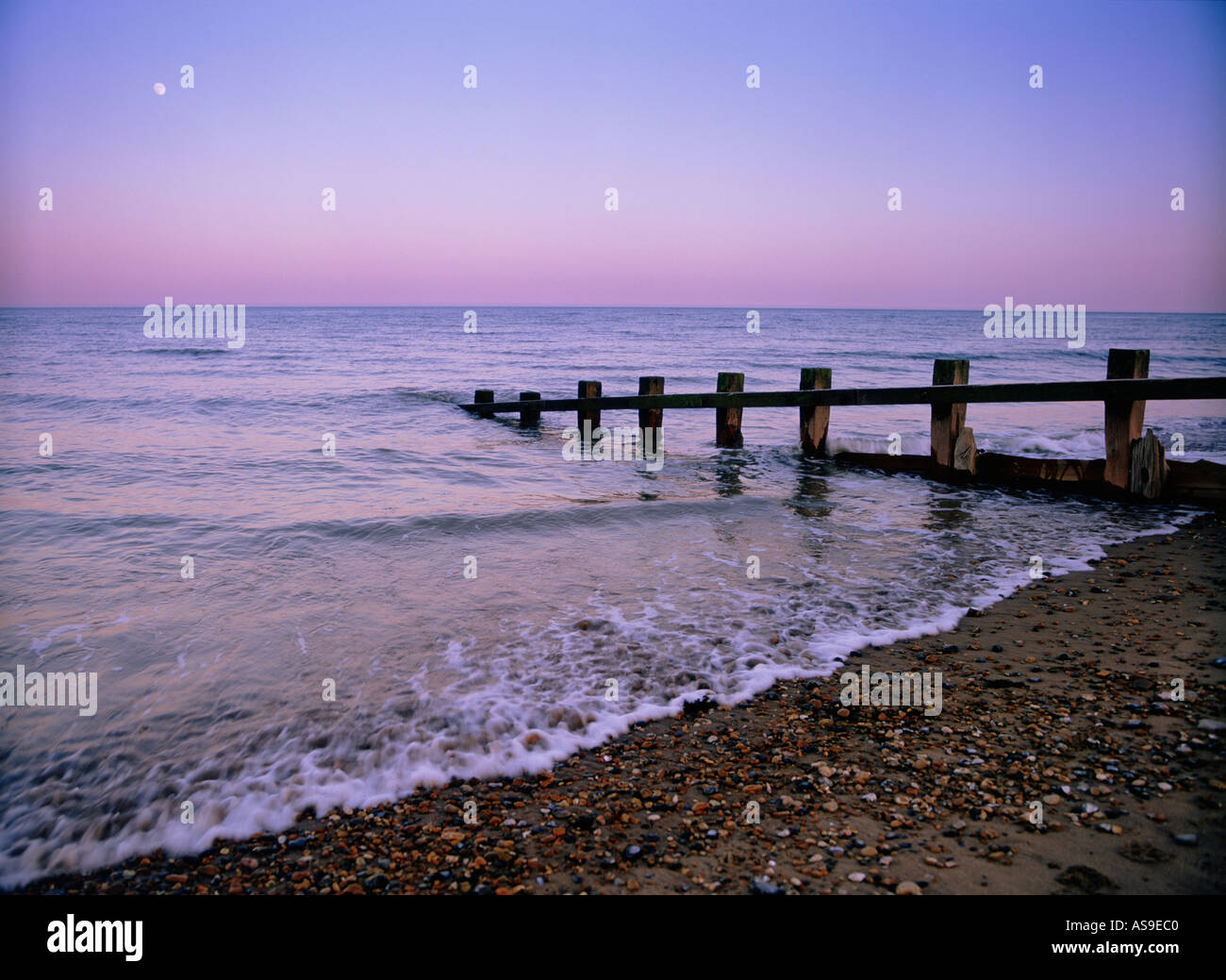 sunset at the beach at pett level east sussex england Stock Photo - Alamy