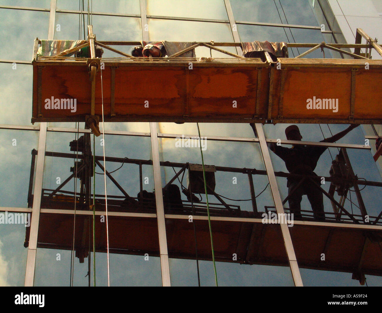 Workers construct scaffolding repair work Stock Photo - Alamy