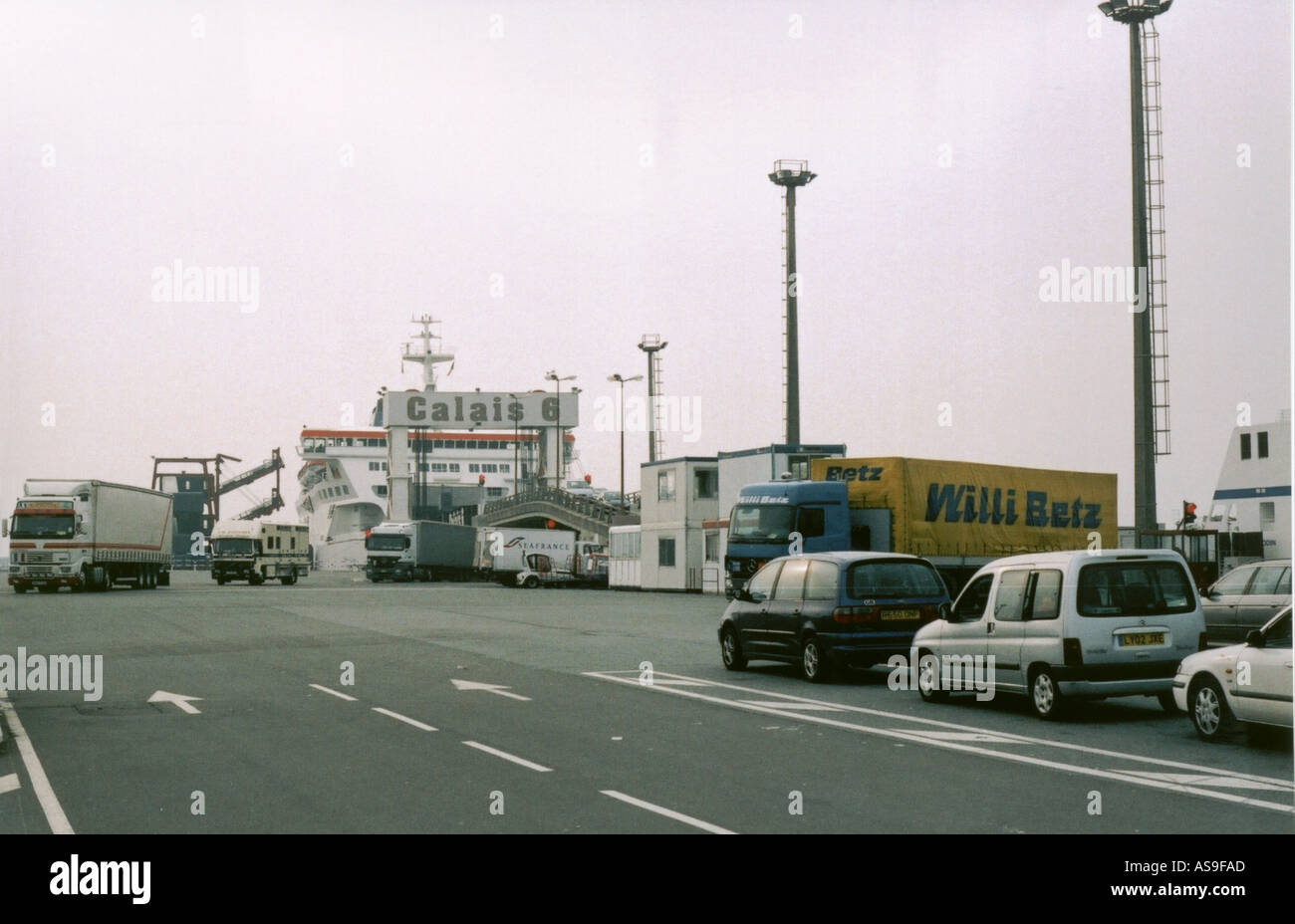 Cross channel ferry unloading and cars waiting to load at Calais in ...