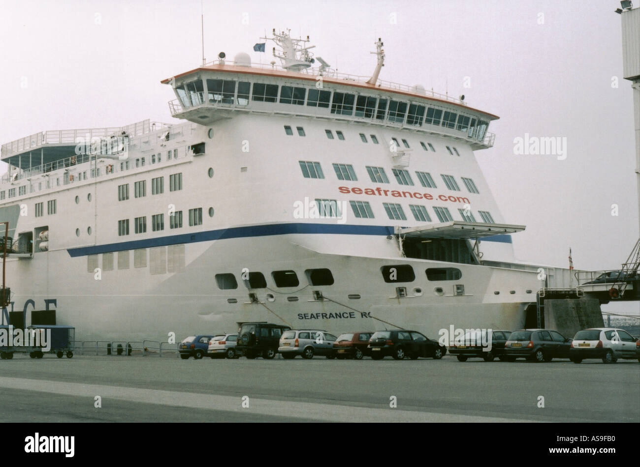 Cross channel ferry unloading and cars waiting to load at Calais in ...
