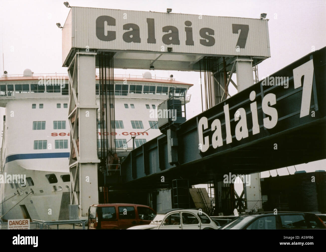 Cross channel ferry unloading and cars waiting to load at Calais in ...